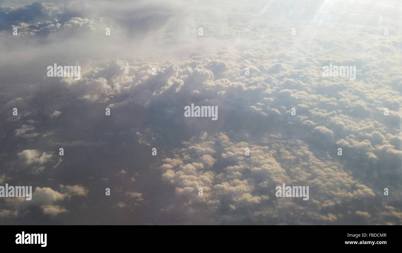Sun Shining In Sky Above Clouds Stock Photo - Alamy