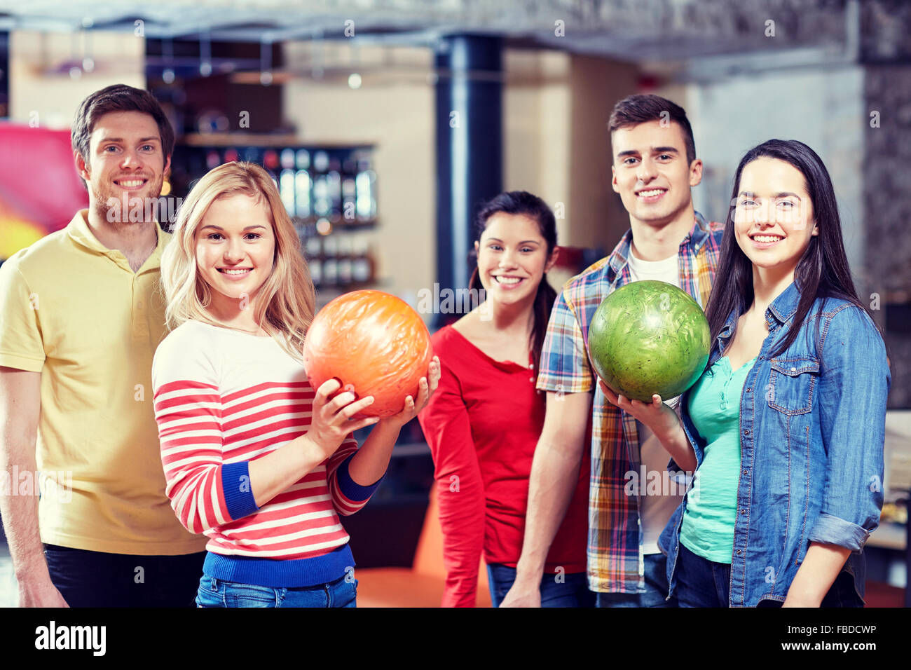 happy friends in bowling club Stock Photo - Alamy
