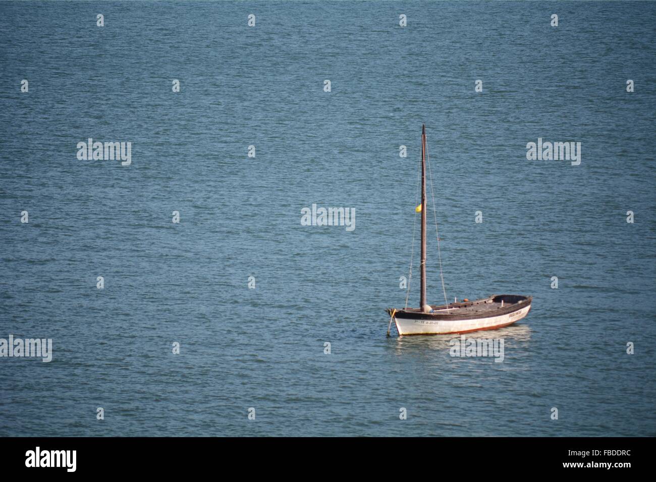 Rowboat In Sea Stock Photo - Alamy