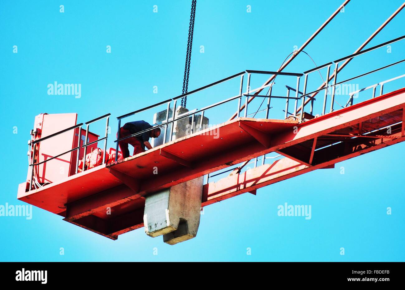 Worker On Crane Stock Photo - Alamy