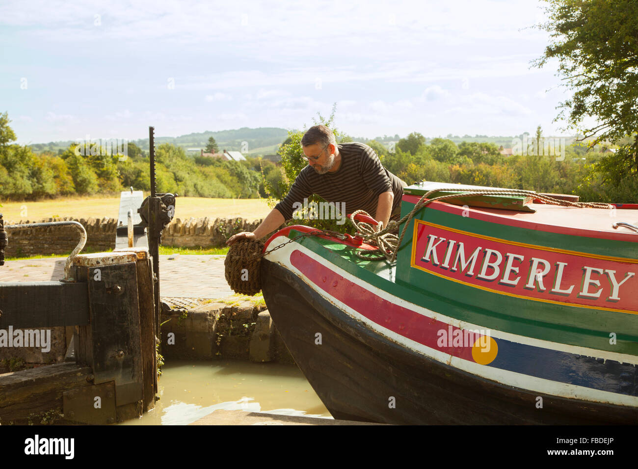 Man on canal boat hi-res stock photography and images - Alamy