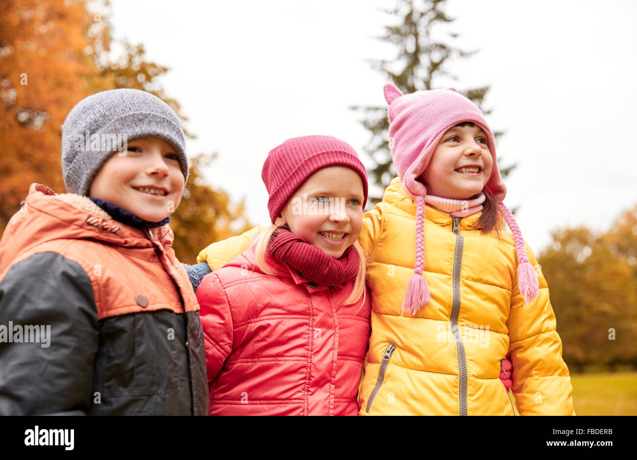 group of happy children hugging in autumn park Stock Photo - Alamy