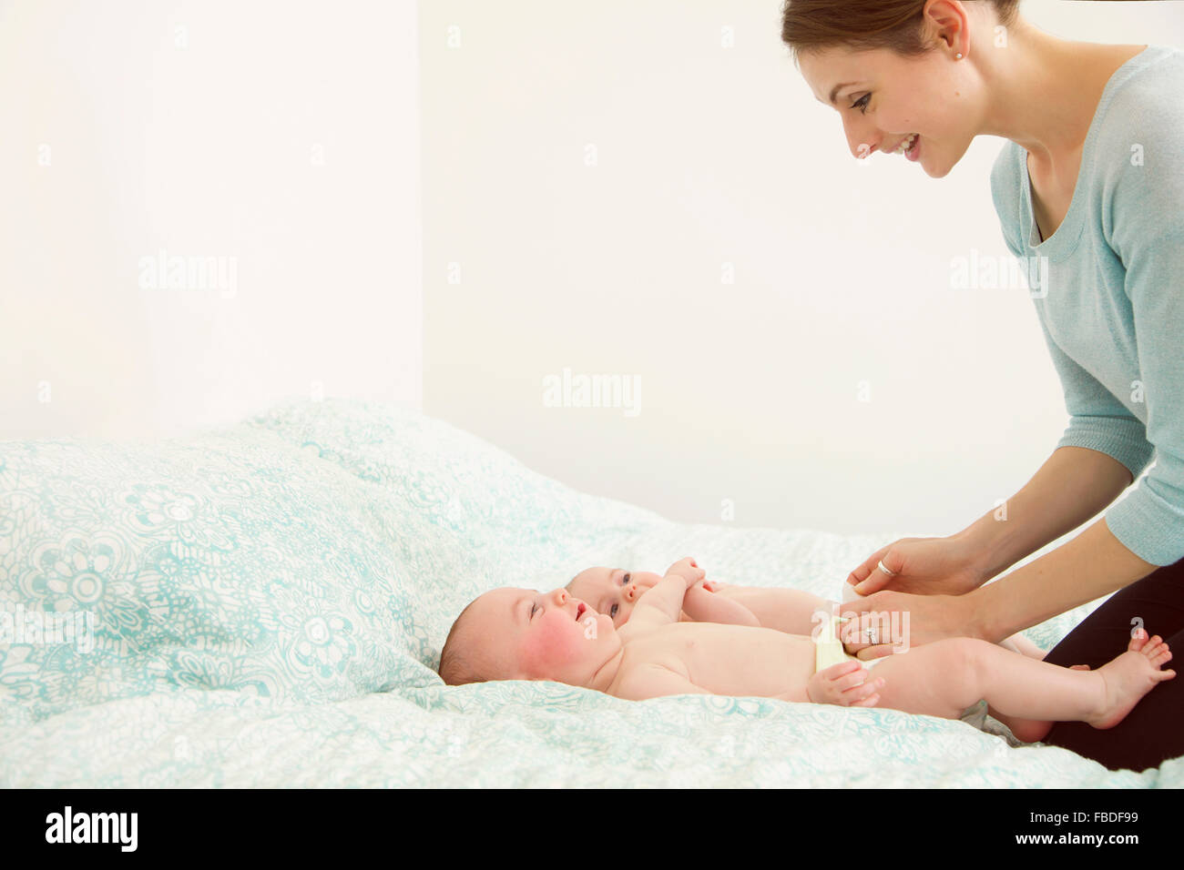 Mother woman kneeling hi-res stock photography and images - Alamy