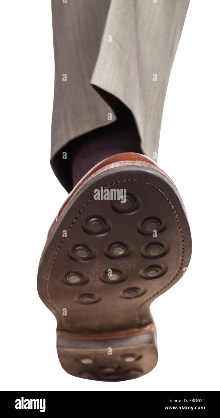 front view of male right leg in brown shoe takes a step isolated on ...