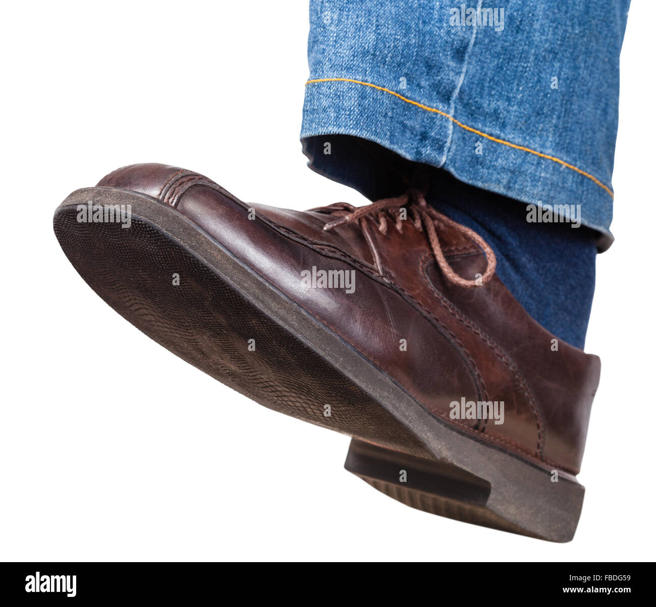 step of male left leg in jeans and brown shoe isolated on white ...