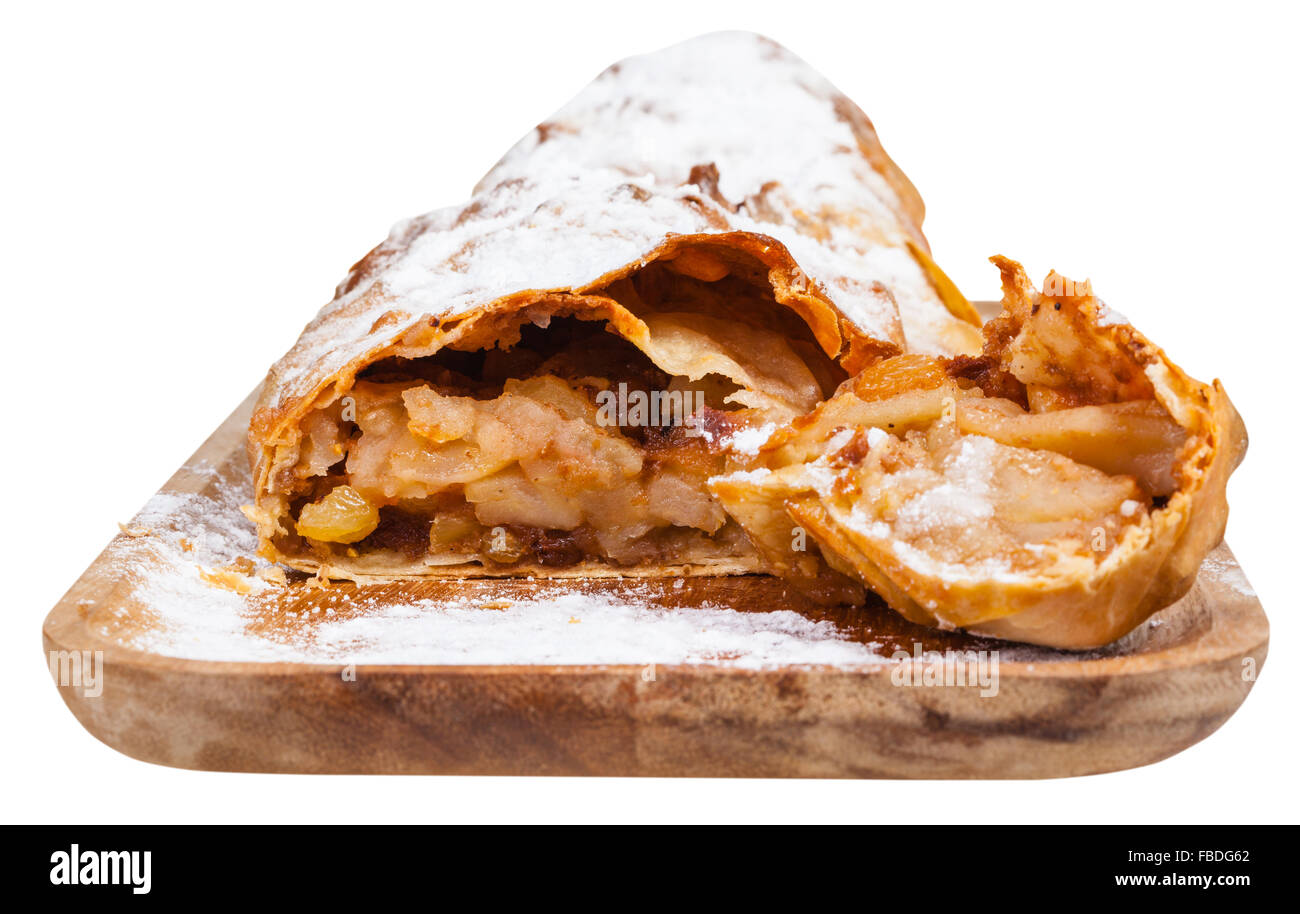piece of typical austrian apple strudel on wooden board isolated on ...