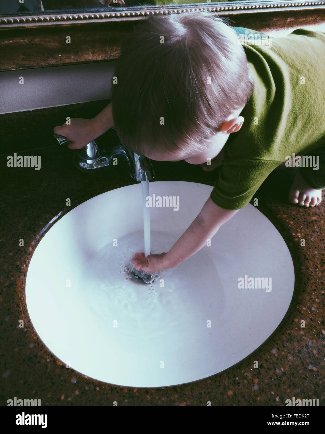 Toddler in sink hi-res stock photography and images - Alamy
