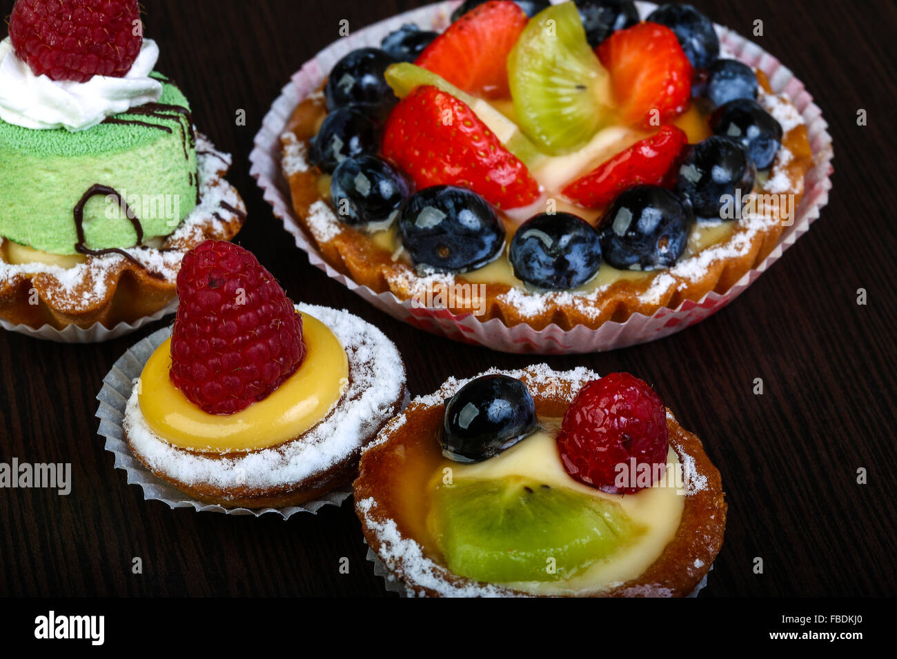 Sweet Pastry with berries on the wood background Stock Photo - Alamy