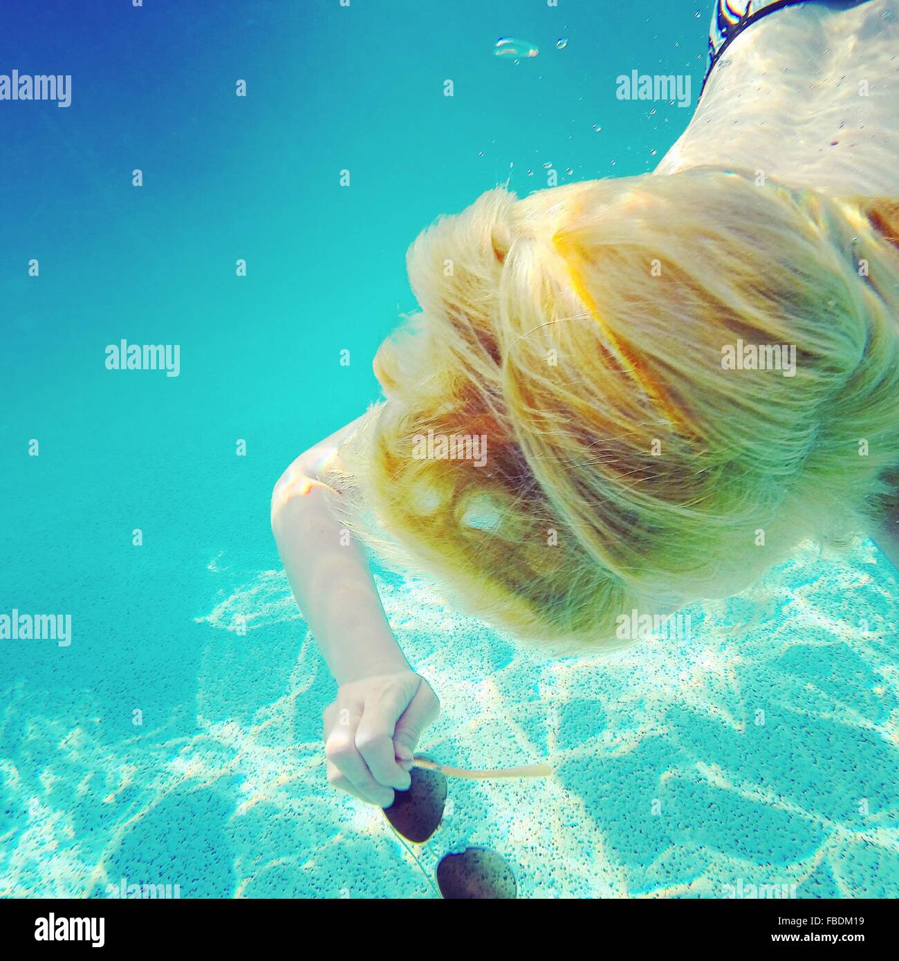 Person underwater swimming up hi-res stock photography and images - Alamy