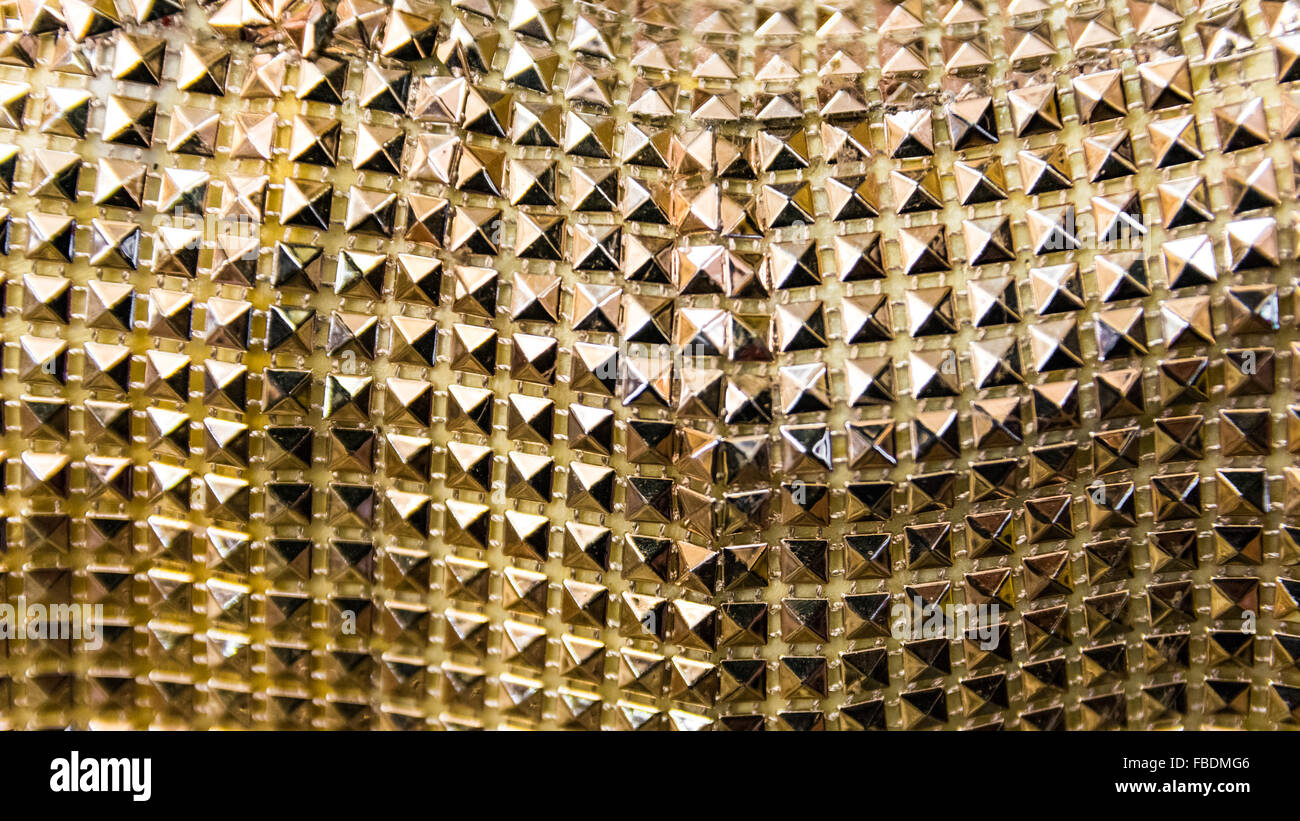 Background formed by a coating of little golden pyramids Stock Photo ...