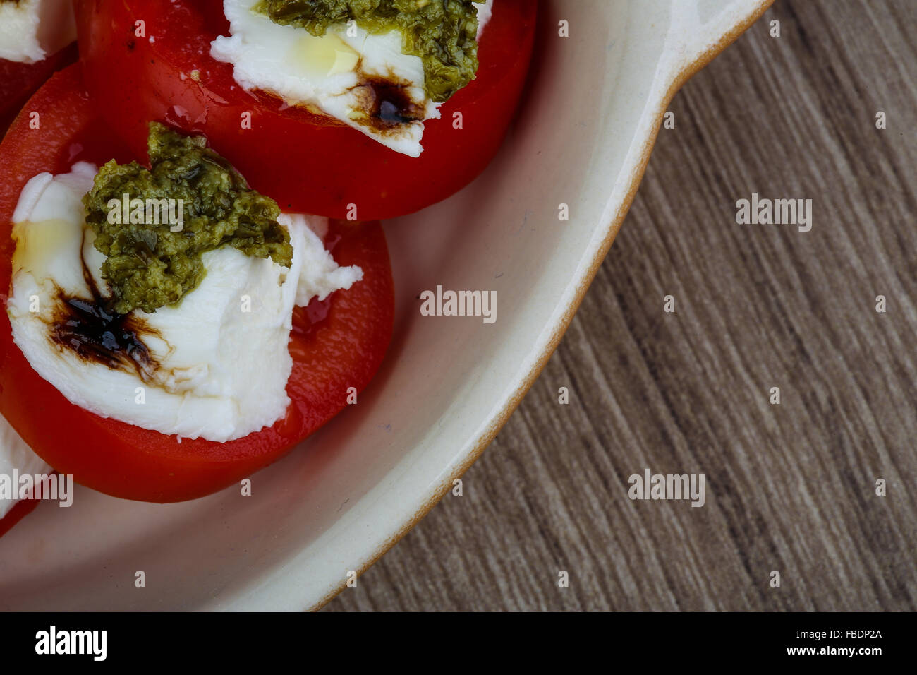 Traditional Italian Caprese salad on the wood background Stock Photo ...