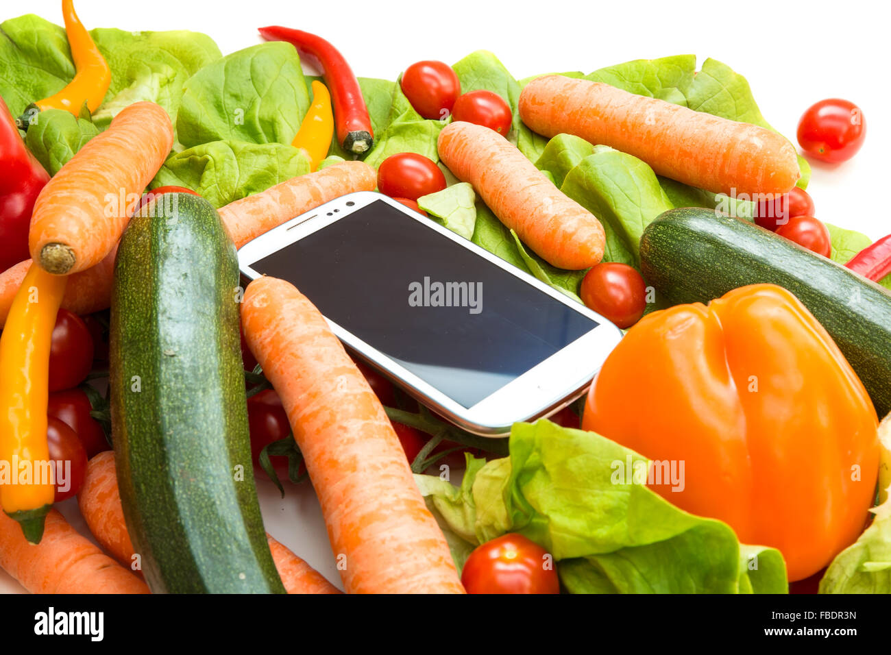 Various vegetables with a Smartphone Stock Photo - Alamy