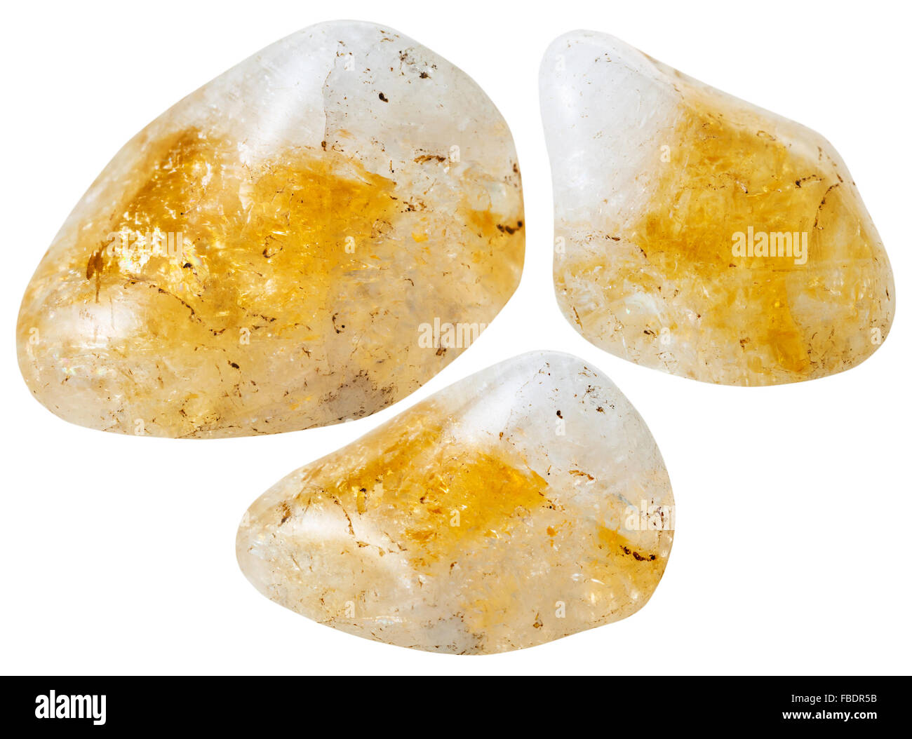 macro shooting of natural mineral stone - three yellow citrine quartz ...