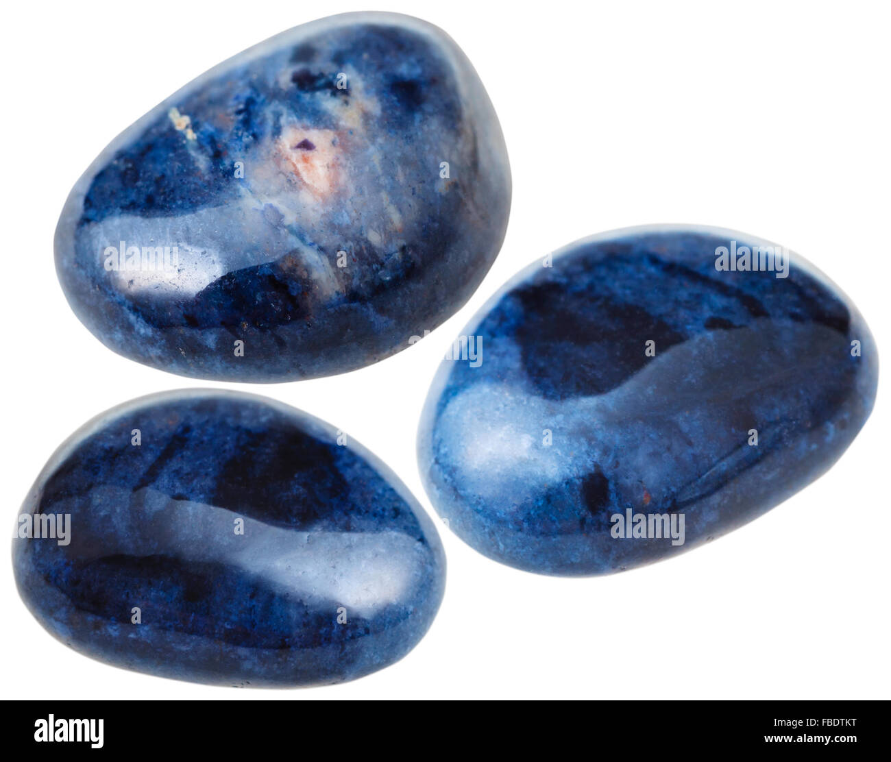 natural mineral gem stone - three Dumortierite gemstones isolated on ...