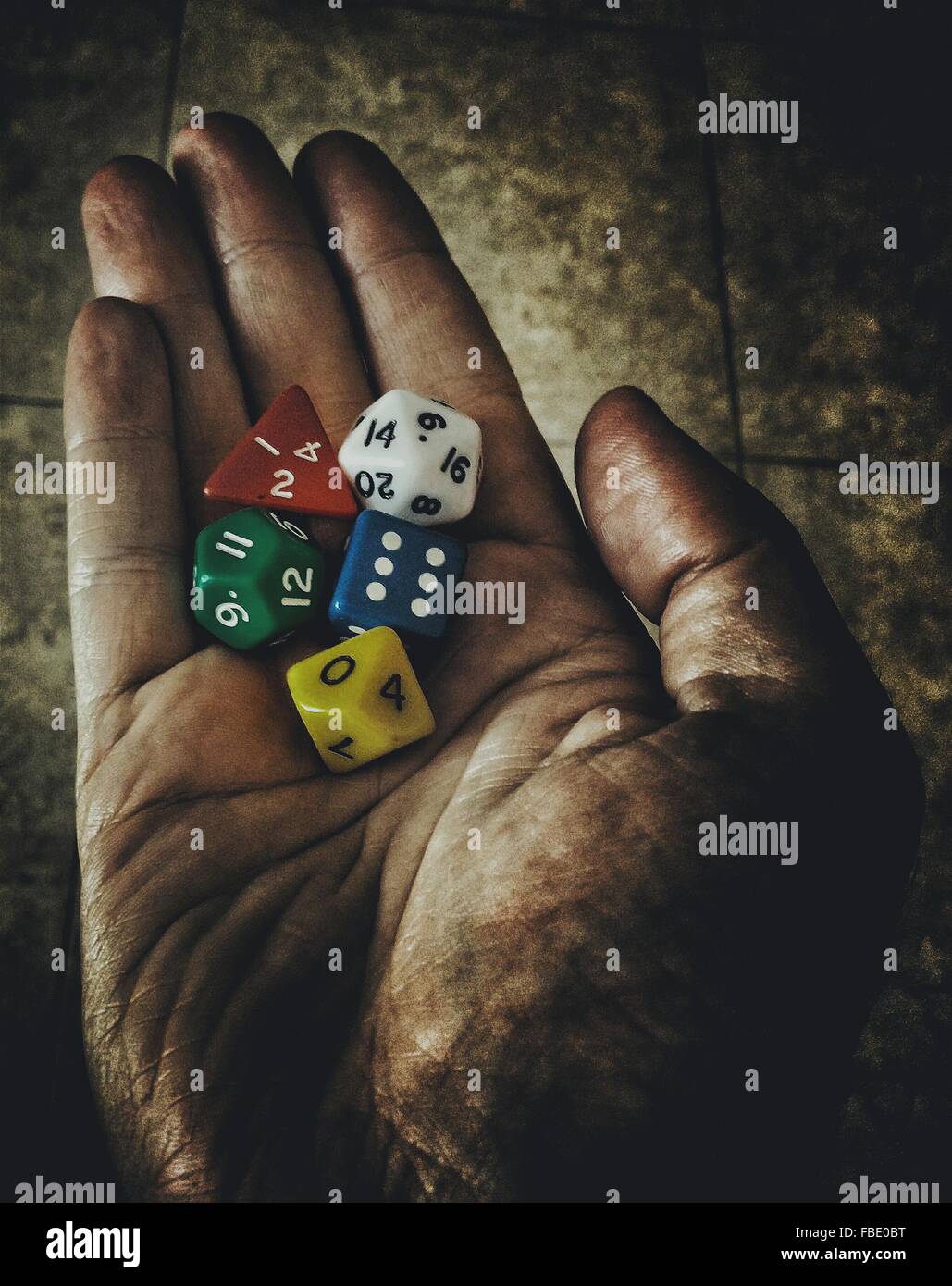 Human hand holding dice hi-res stock photography and images - Alamy