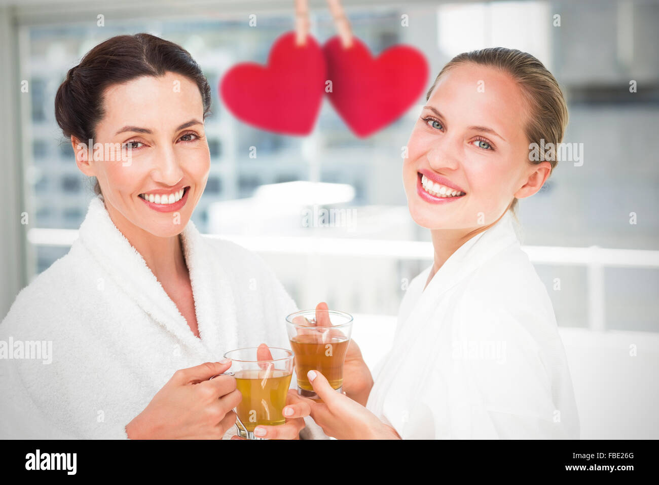 Composite image of couple friends having a spa day Stock Photo - Alamy