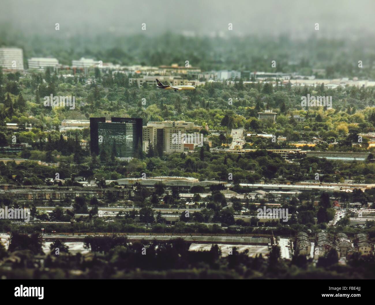 Airplane Flying Over City Stock Photo - Alamy