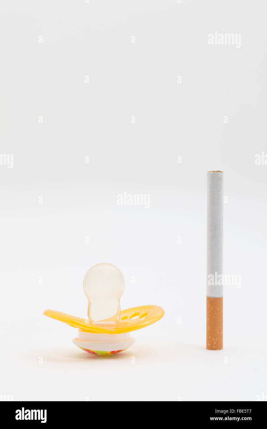 pacifier and cigarette Stock Photo - Alamy