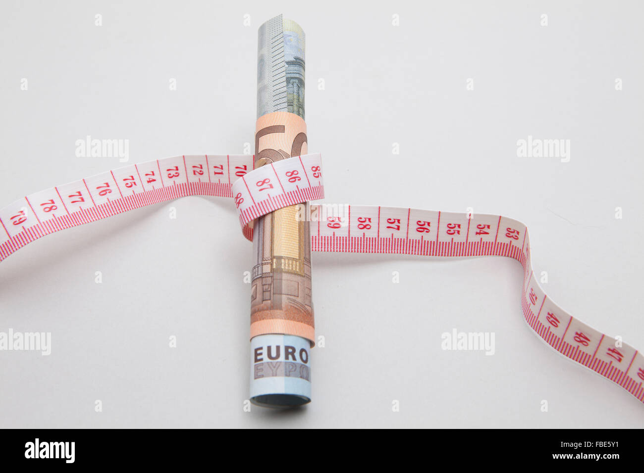 money and tape measure Stock Photo - Alamy