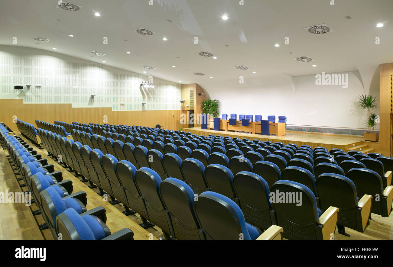 Conference and press hall with blue chairs Stock Photo - Alamy
