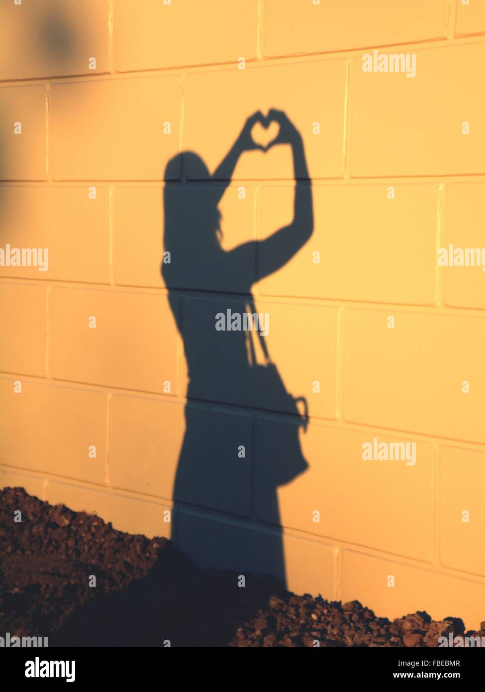 Woman forming heart at hi-res stock photography and images - Alamy