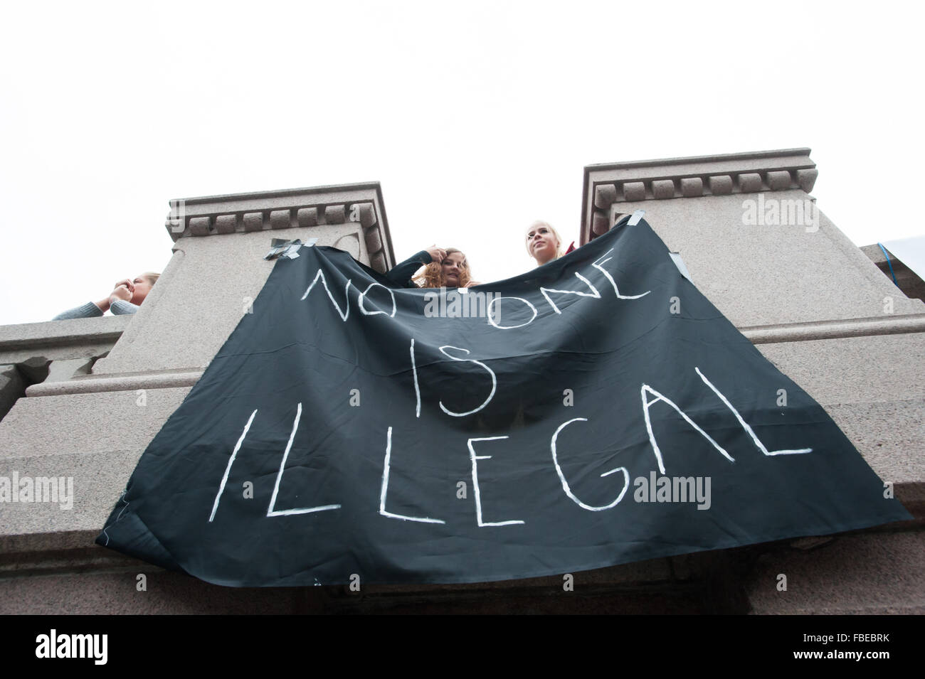 Norwegians Rallying In Support Of Syrian Refugees Hold A Banner Reading
