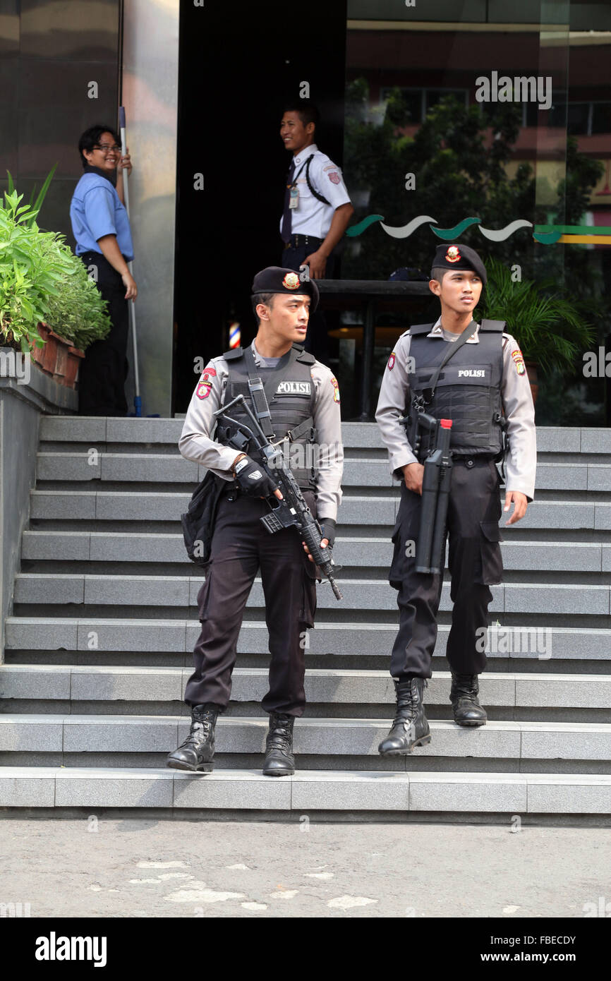 Jakarta, Indonesia. 15th Jan, 2016. Armed Indonesian police stand guard ...