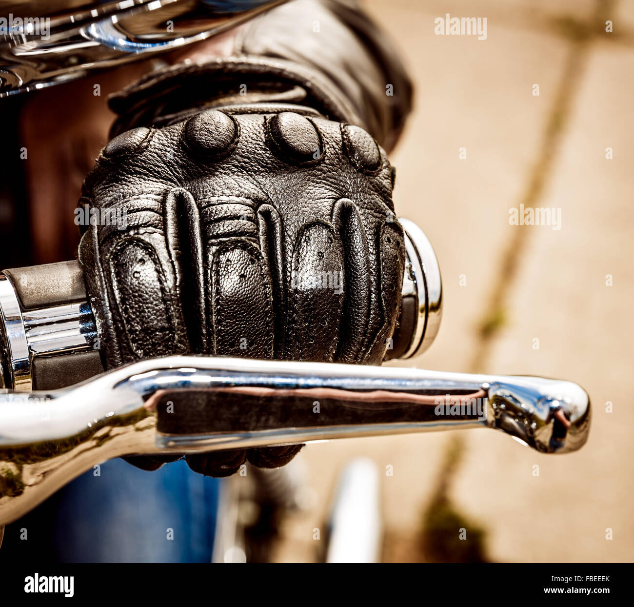 Human hand in a Motorcycle Racing Gloves holds a motorcycle throttle ...