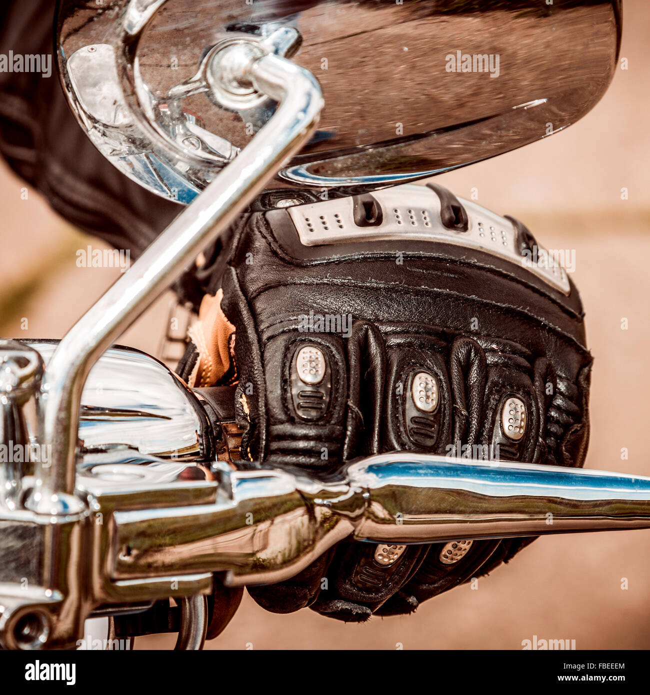 Human hand in a Motorcycle Racing Gloves holds a motorcycle throttle ...