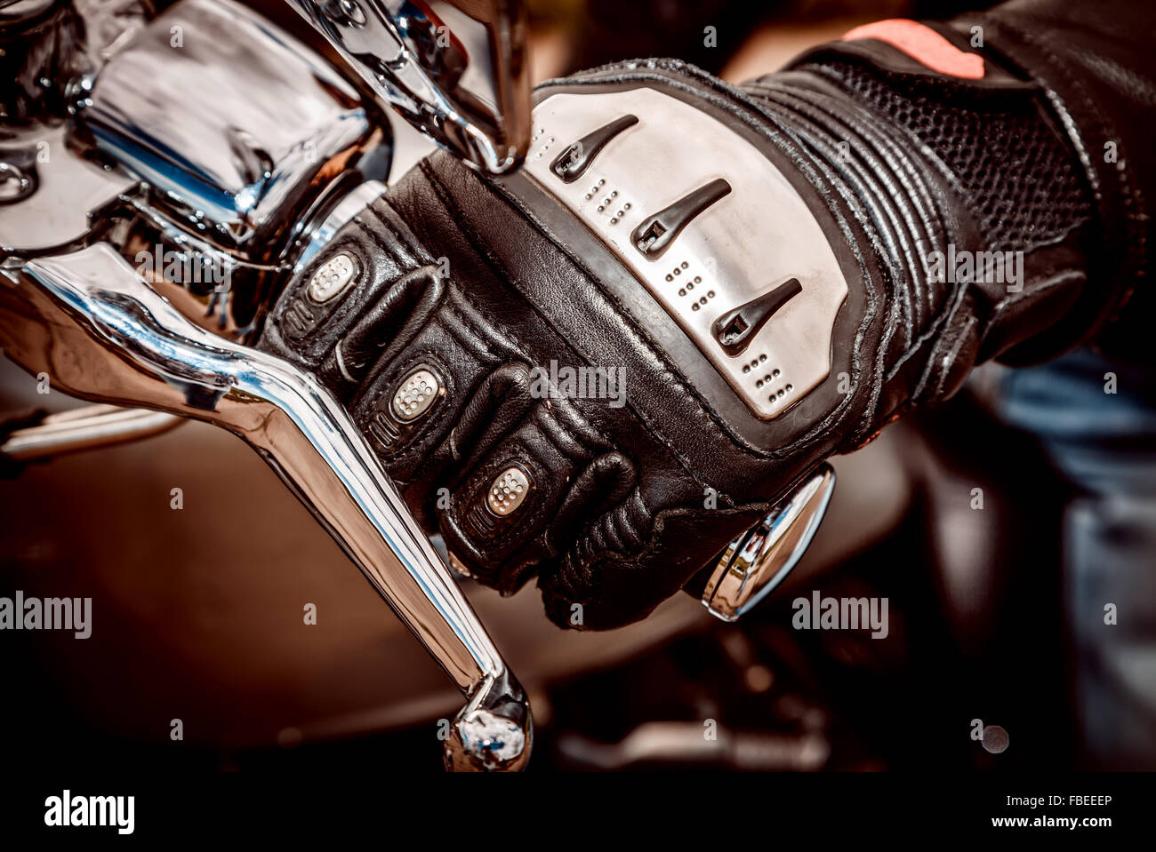 Human hand in a Motorcycle Racing Gloves holds a motorcycle throttle ...