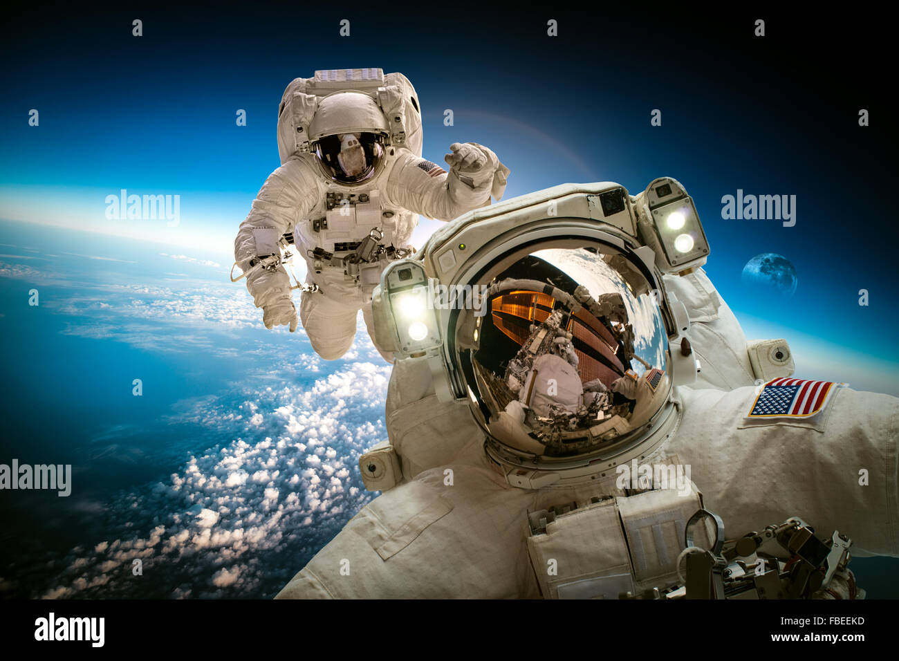 Astronaut in outer space against the backdrop of the planet earth ...