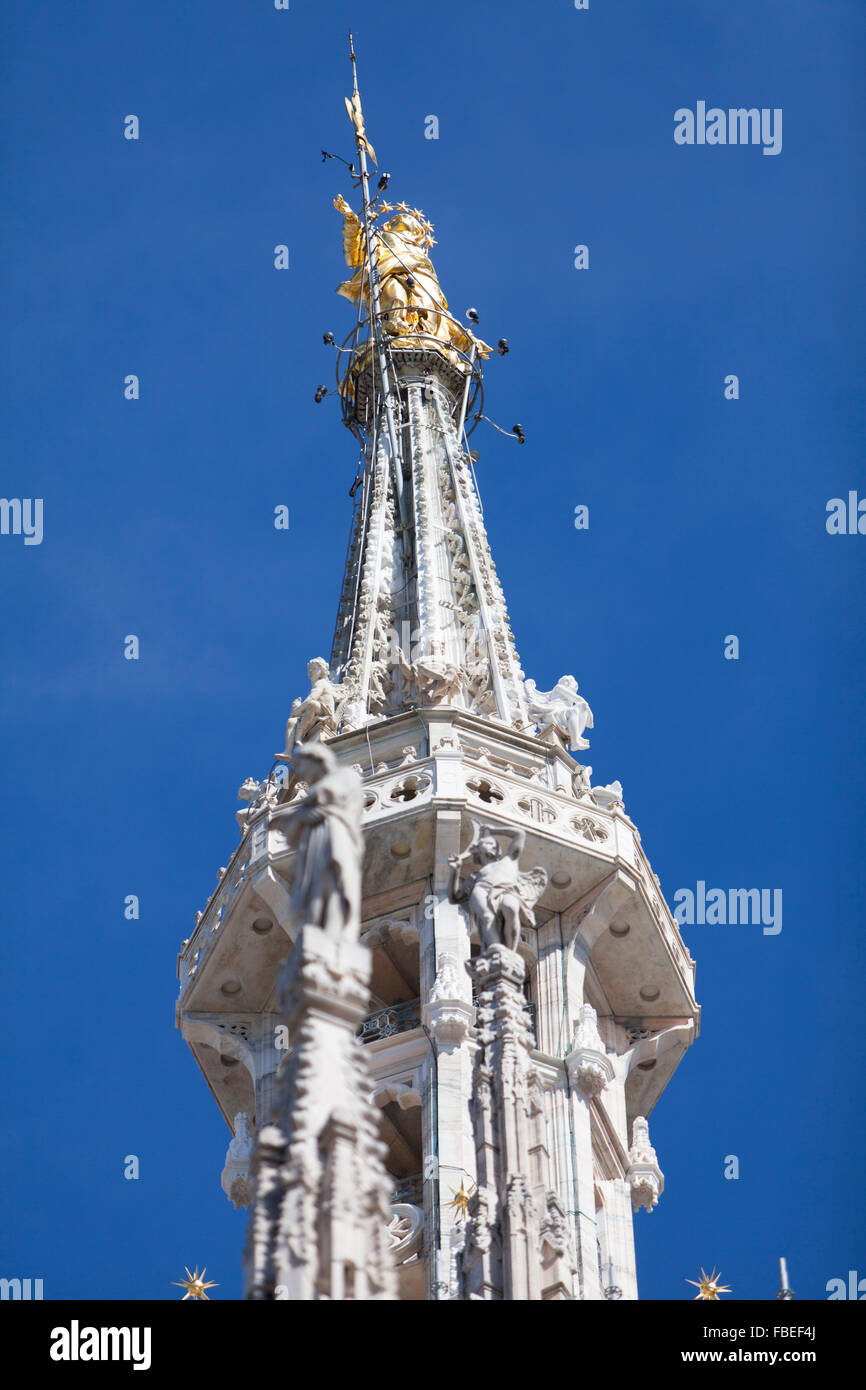 Madonna statue in gilded copper by giuseppe perego on the main spire of ...