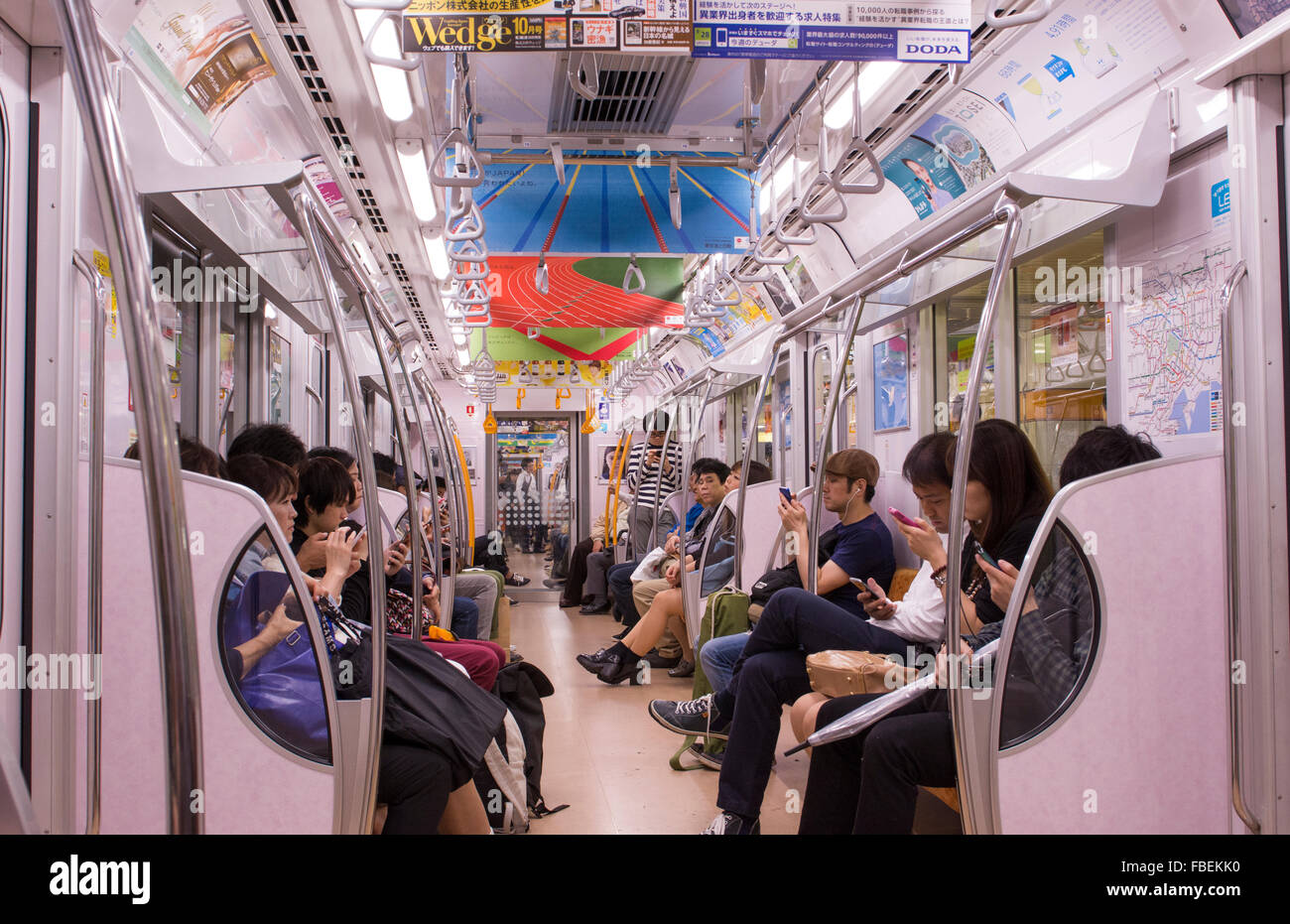 Tokyo Japan crowds subway car with locals going to work in crowded ...