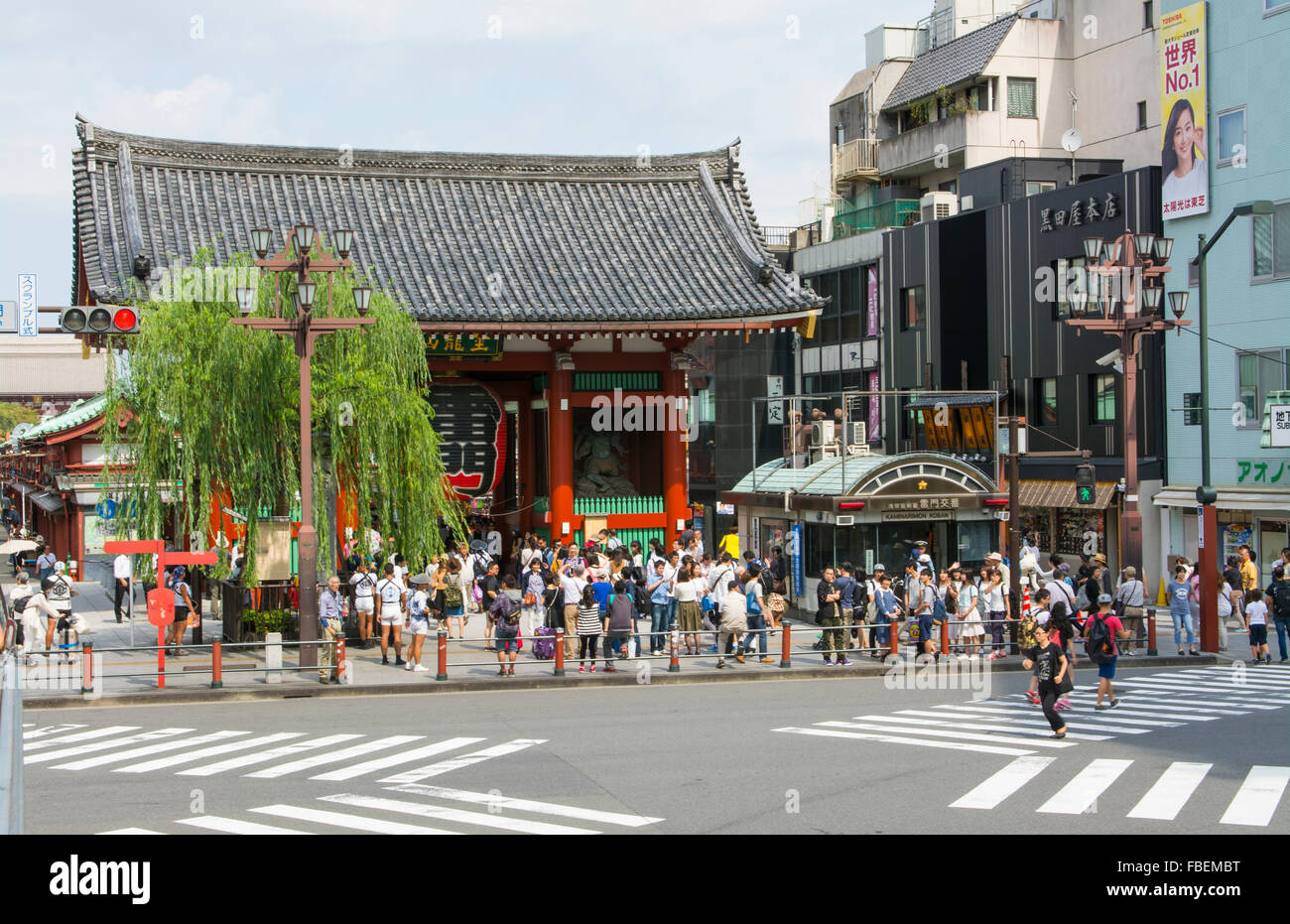 Tokyo Japan temple and local traffic and walkers in downtown city with ...