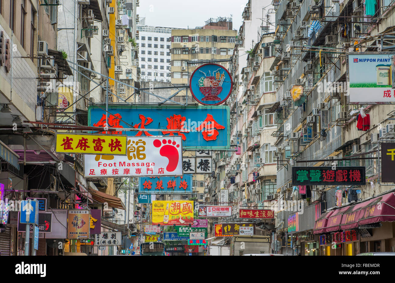 Hong Kong China traffic Kowloon Woosung Street with signs overhanging ...