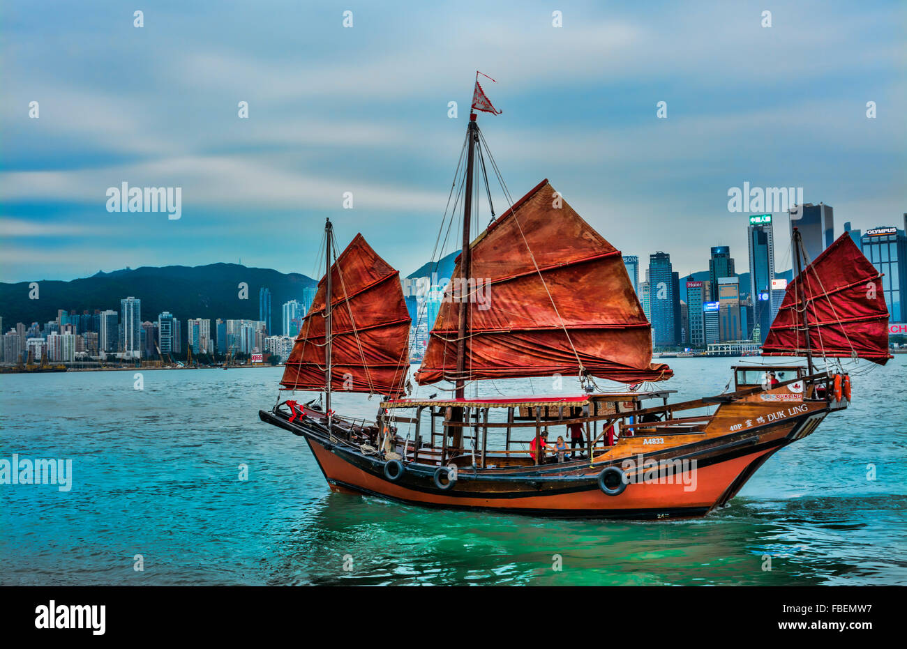 Hong Kong China skyline from water with traditional junk boat against ...