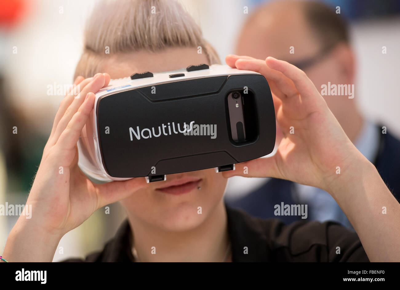 A woman tests the 'Nautilus' head mounted display at the 'Opti ...