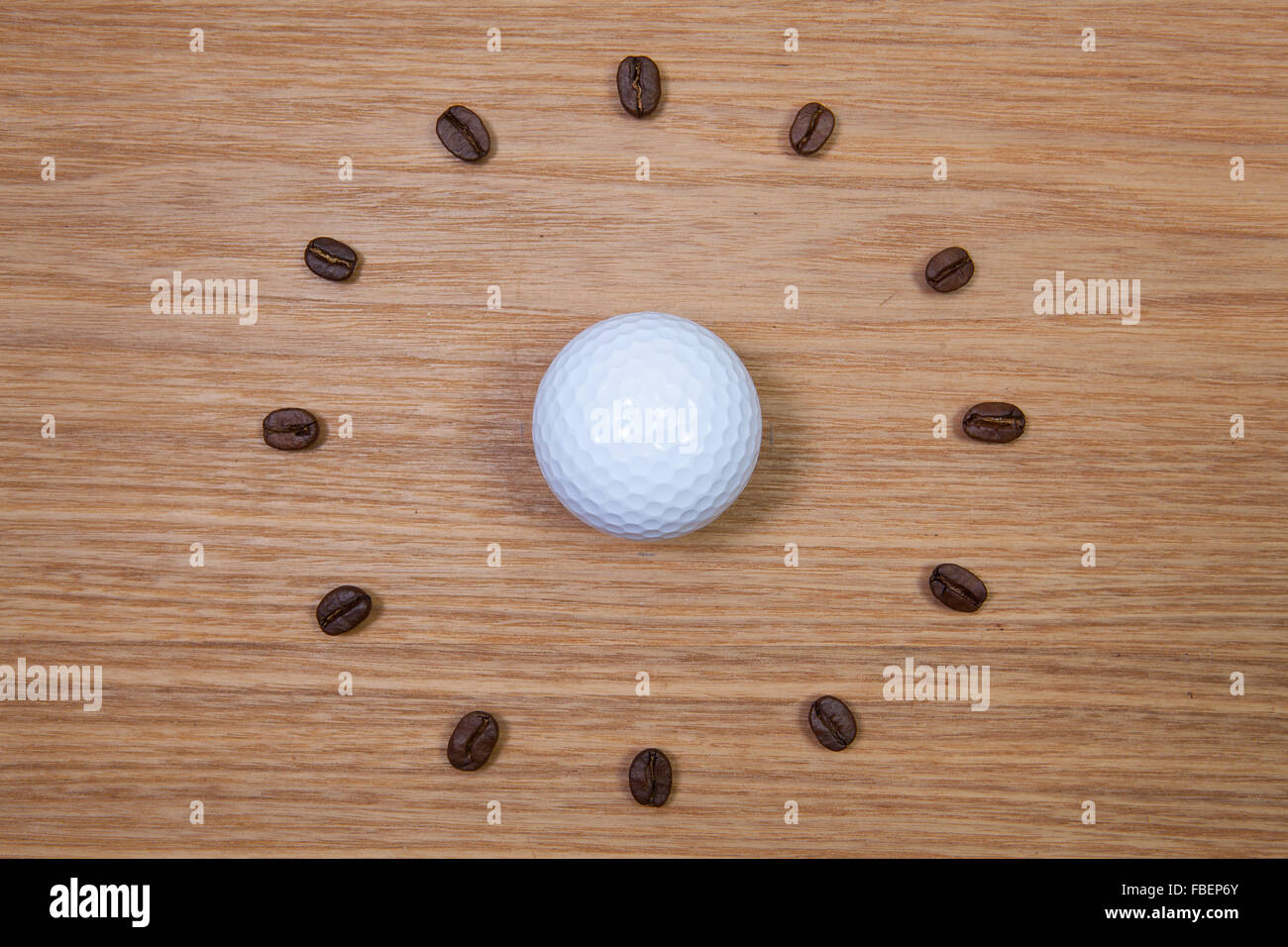 Coffee Time - White golf ball and clock of coffee beans Stock Photo - Alamy