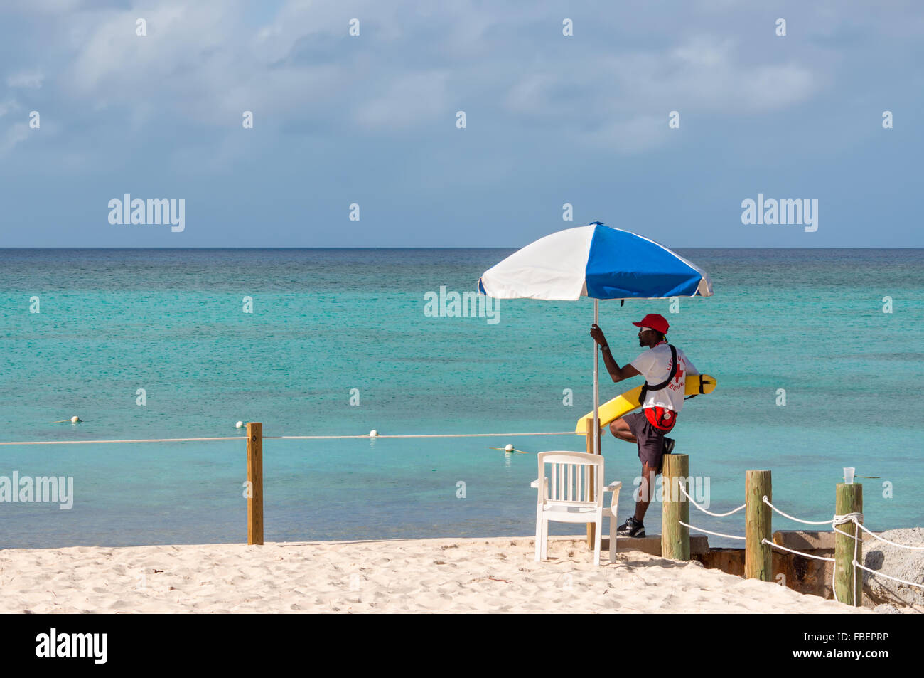 A red cross lifeguard is patrolling the tropical beach Stock Photo - Alamy