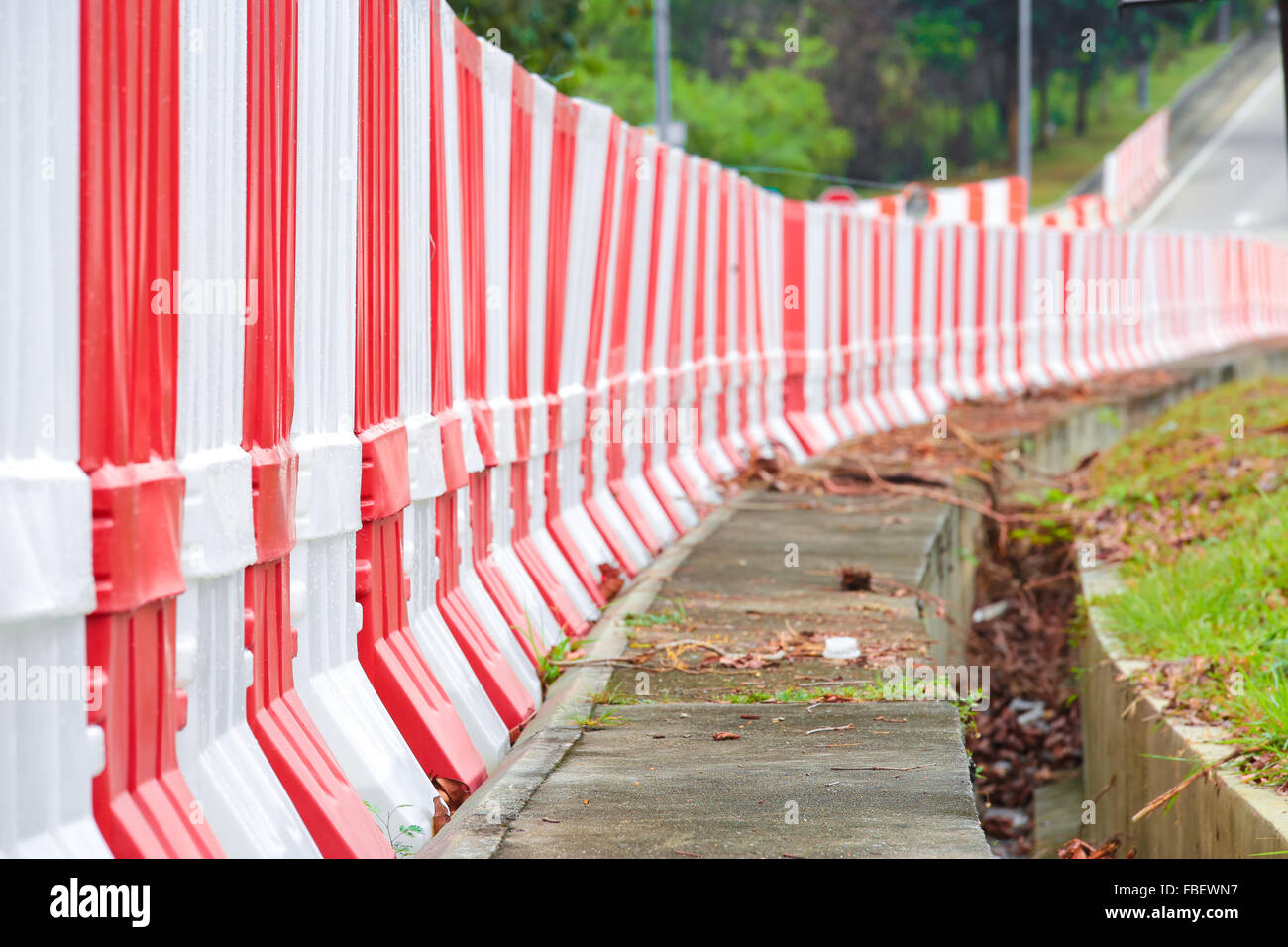 Road barriers erected along the work in progress construction area ...