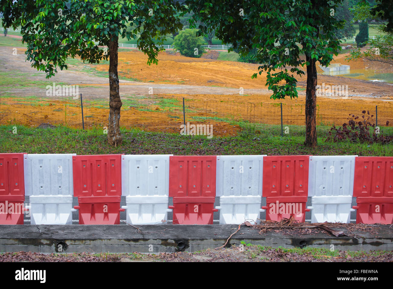 Road barriers erected along the work in progress construction area ...