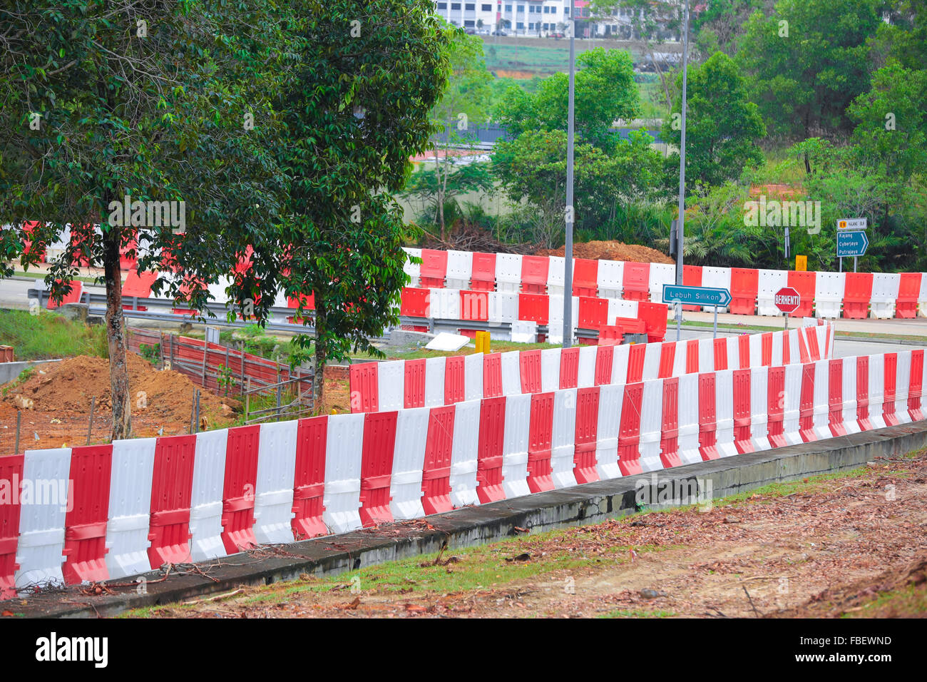 Road barriers erected along the work in progress construction area ...