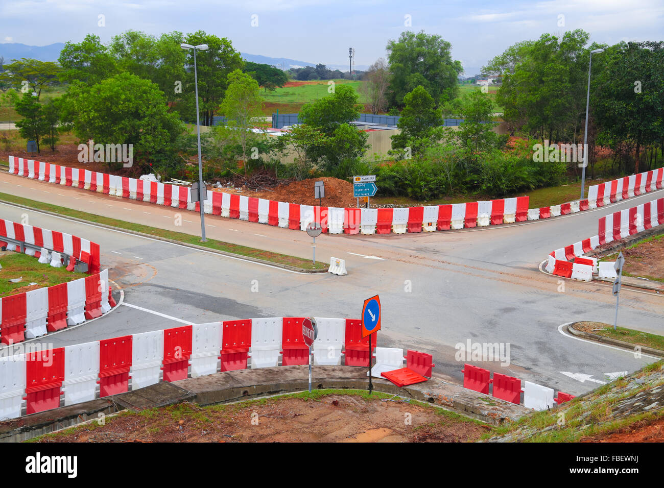 Road barriers erected along the work in progress construction area ...