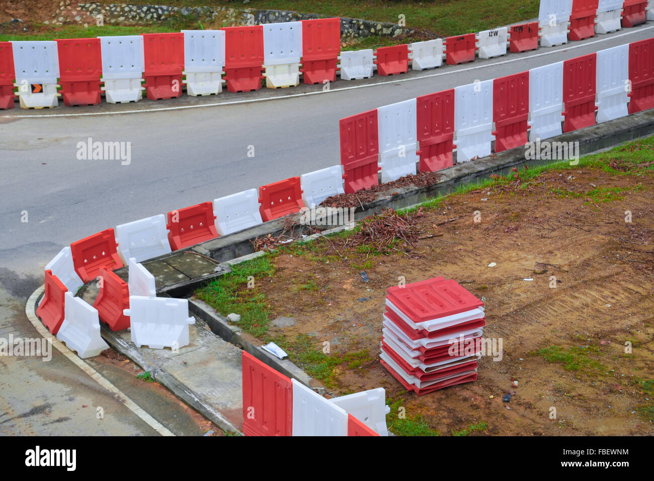Road barriers erected along the work in progress construction area ...