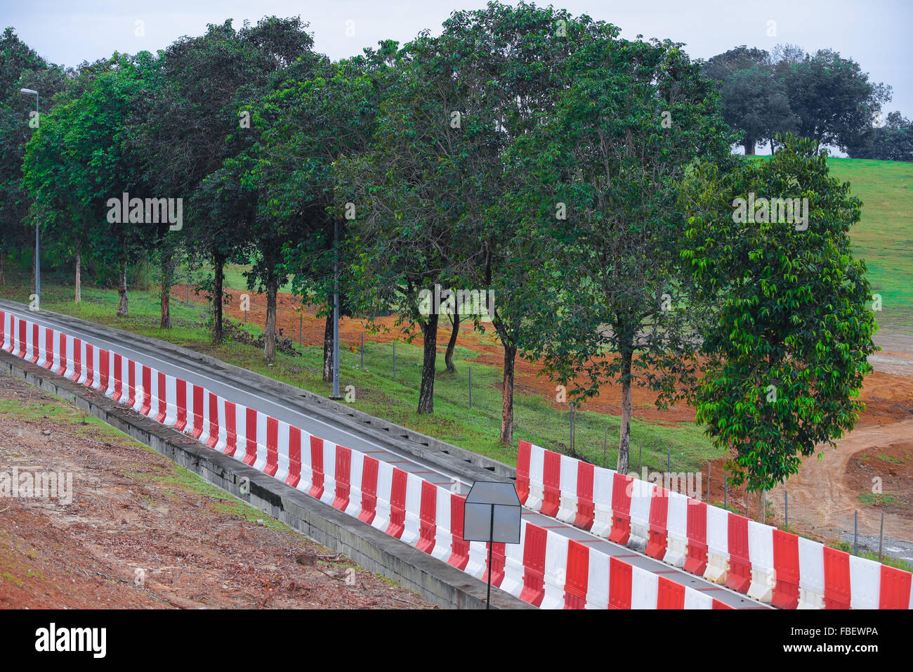 Road barriers erected along the work in progress construction area ...