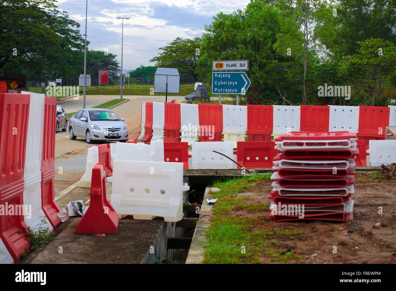 Plastic road barriers used in the work in progress construction area ...