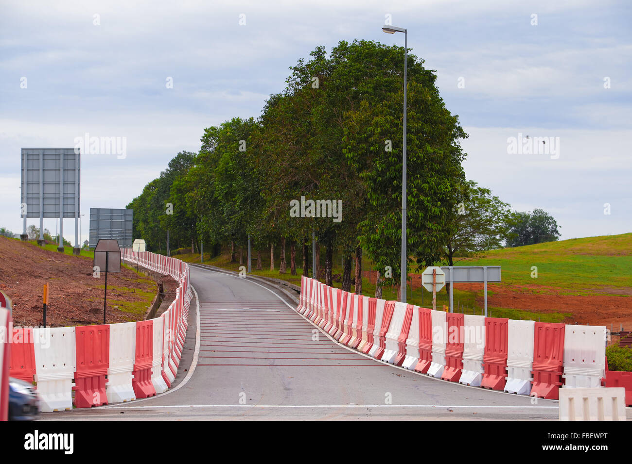 Road barriers erected along the work in progress construction area ...