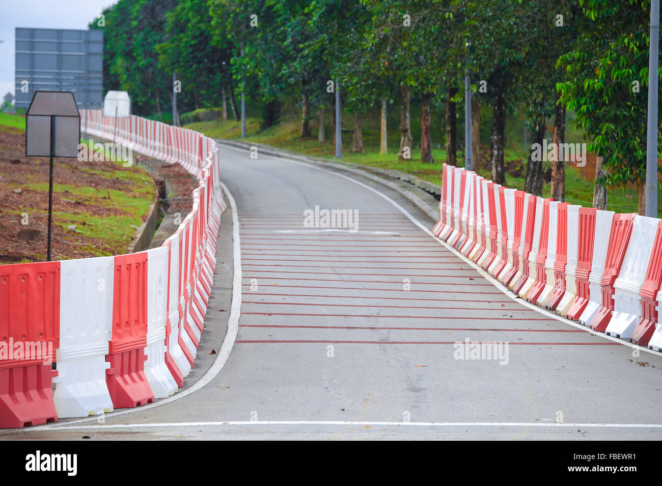 Road barriers erected along the work in progress construction area ...