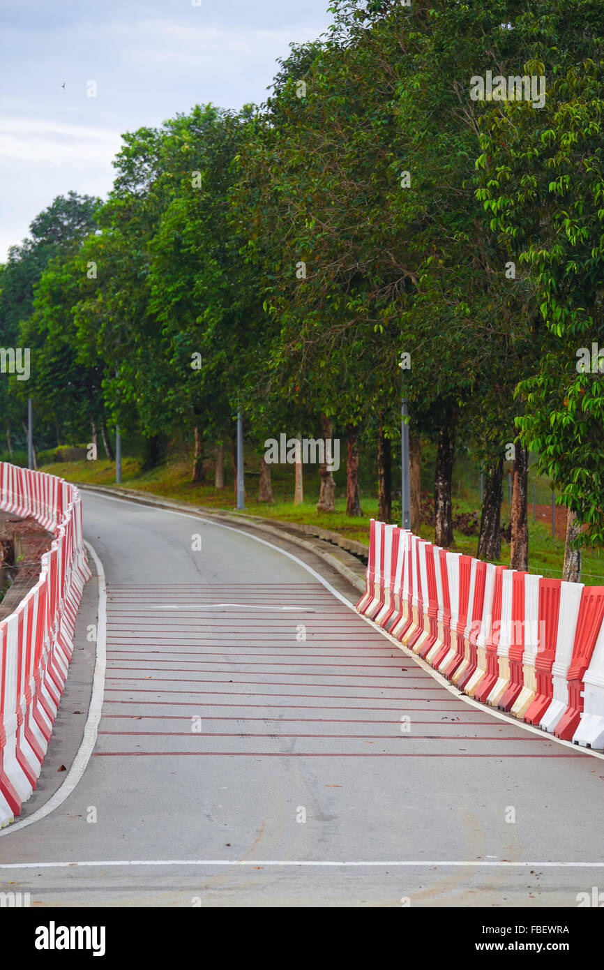 Road barriers erected along the work in progress construction area ...