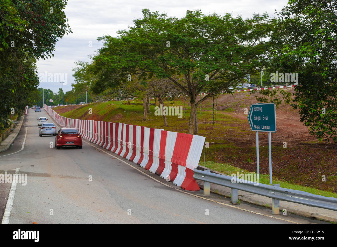 Road barriers erected along the work in progress construction area ...